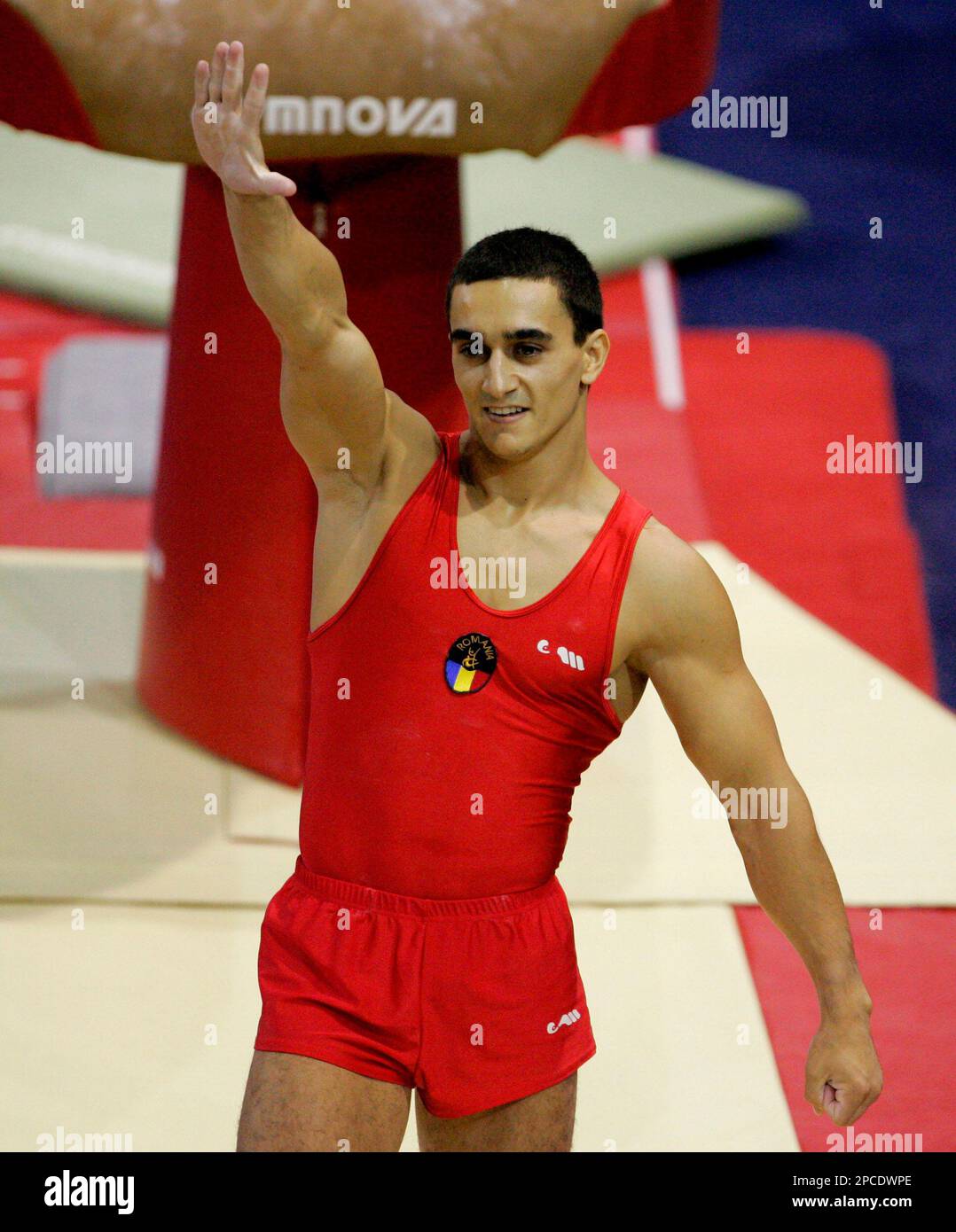 Gold medalist Romania's Marian Dragulescu waves to the crowd after ...