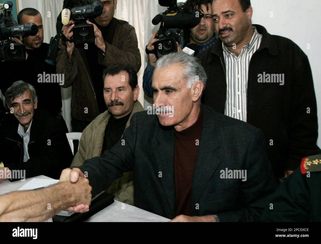 ** FILE ** Palestinian security commander Ismail Jaber, center, shakes ...