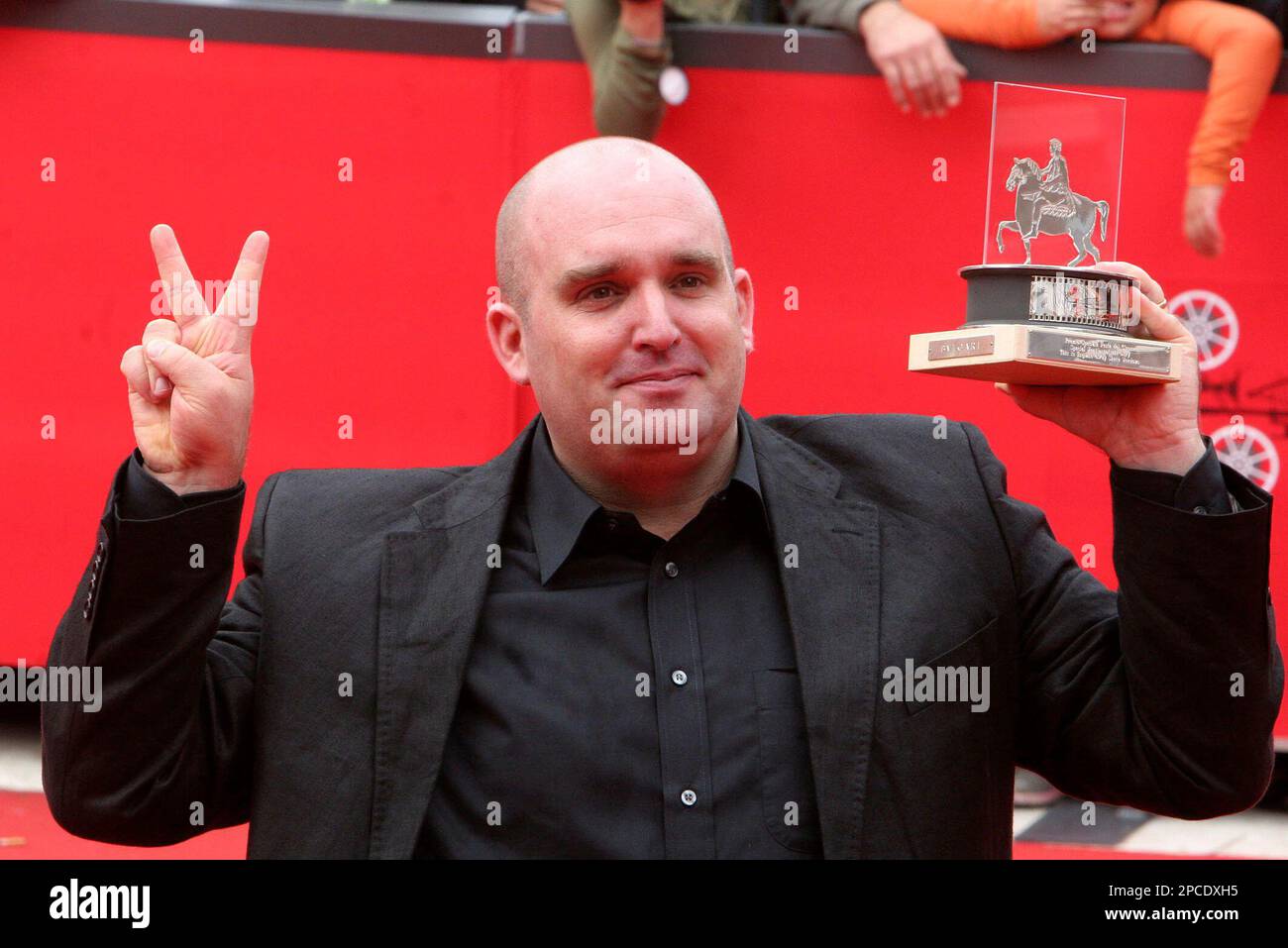 Britain's Shane Meadows shows the festival's special jury prize that ...