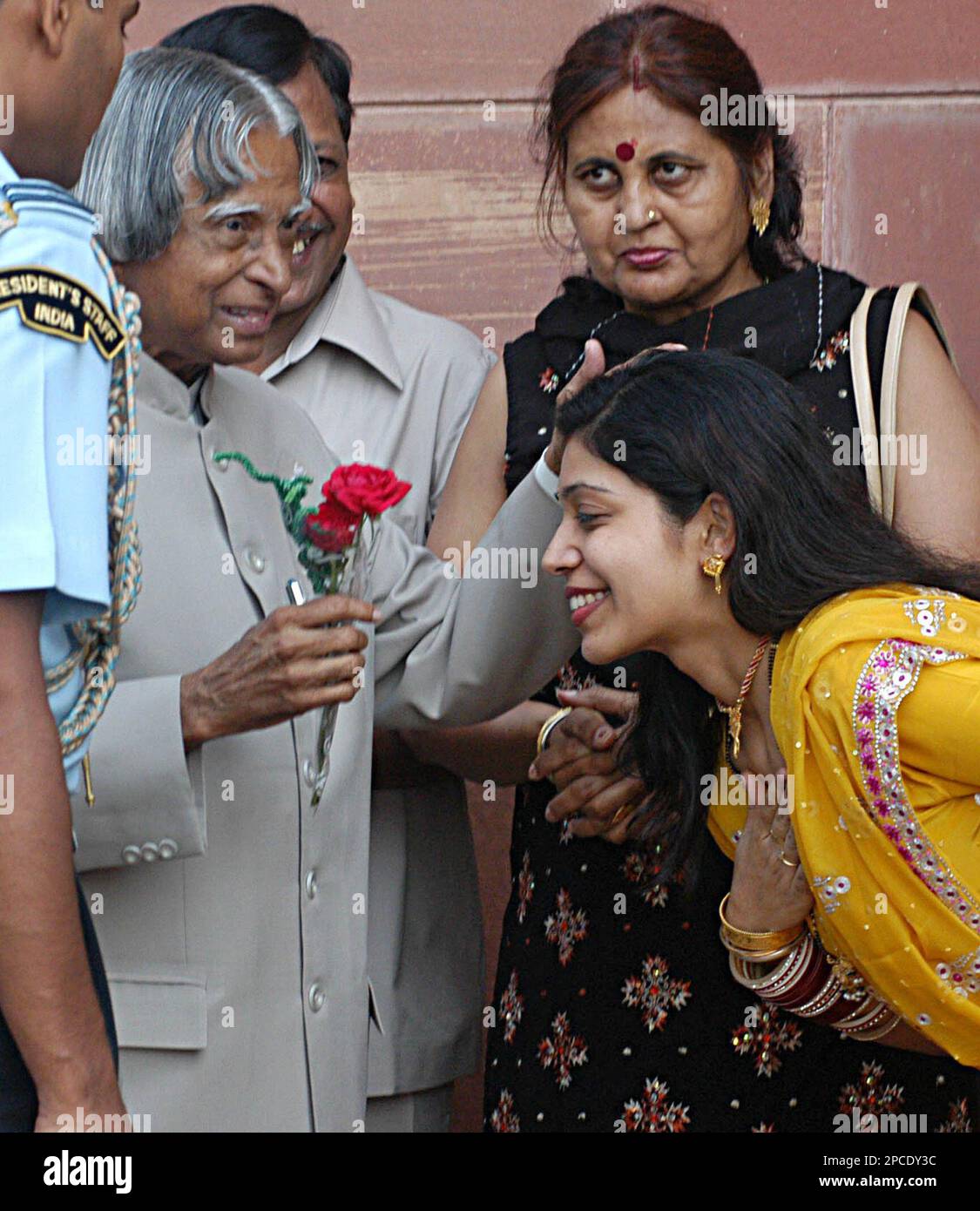 Indian president APJ Abdul Kalam, holding rose, greets visitors on the ...