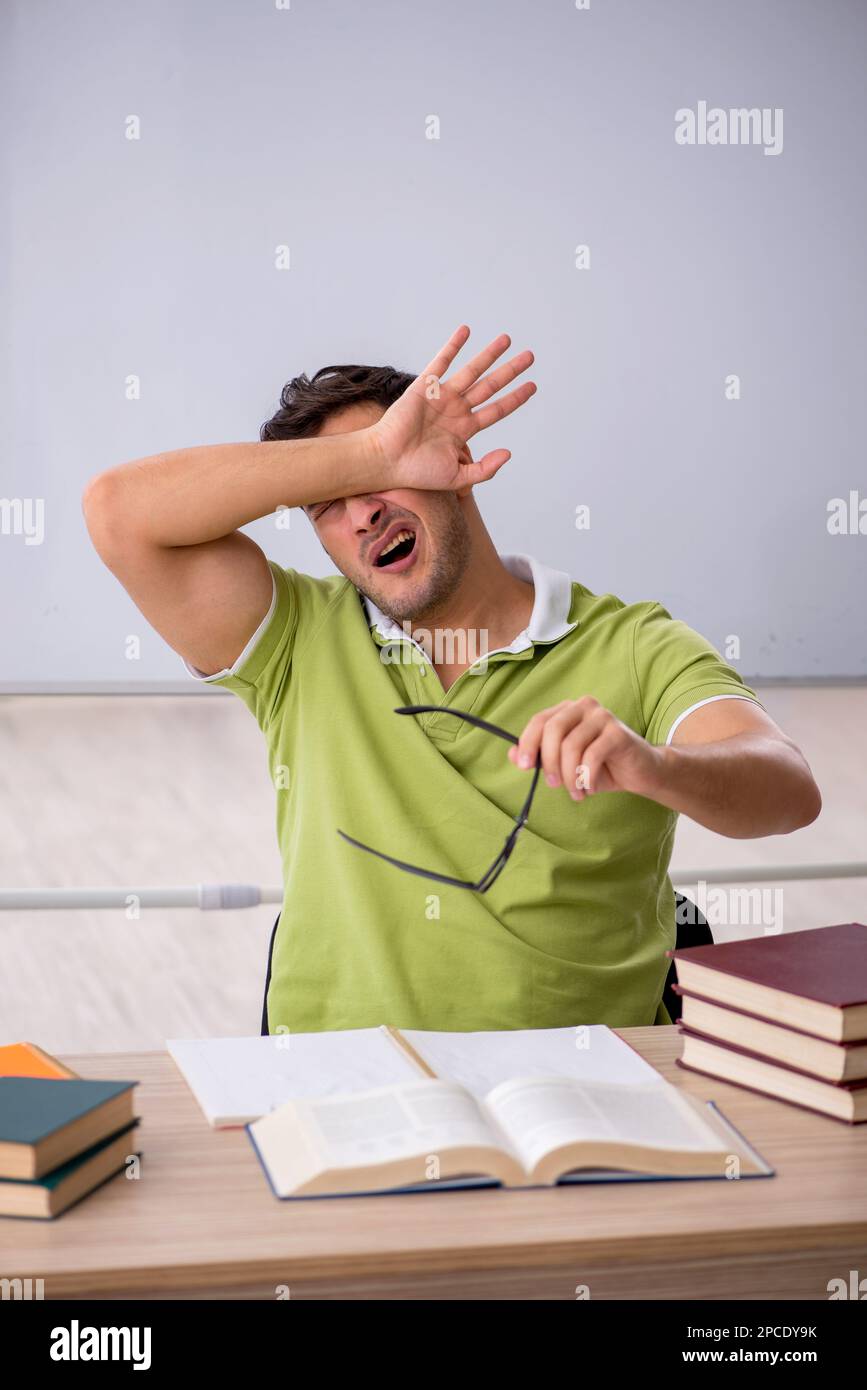 Young student sitting in the classroom in front of whiteboard Stock ...