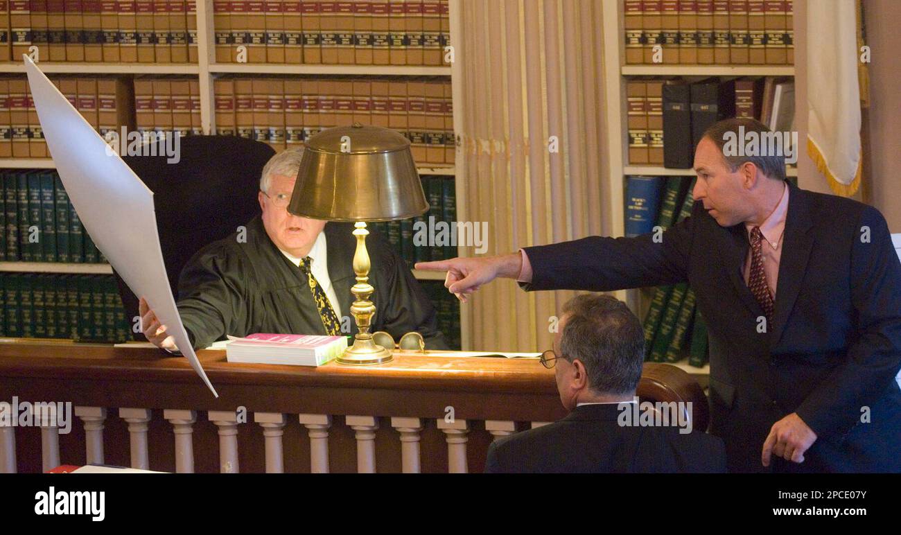 State police detective Joseph Condon points out the location of Christa ...