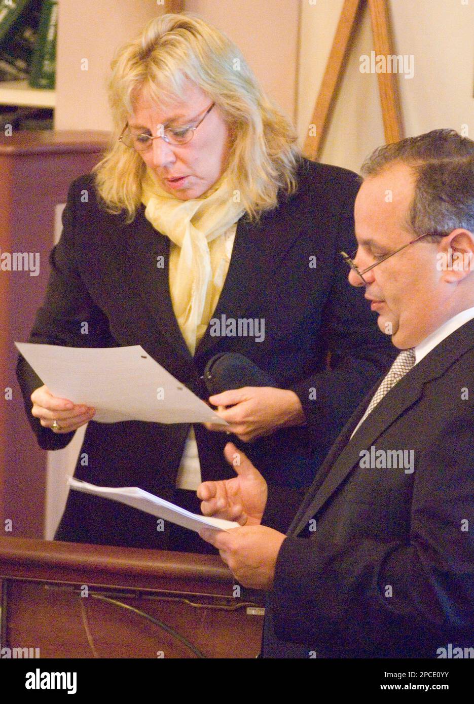 Defense attorney Robert George, right, asks Jan Worthington, cousin of ...