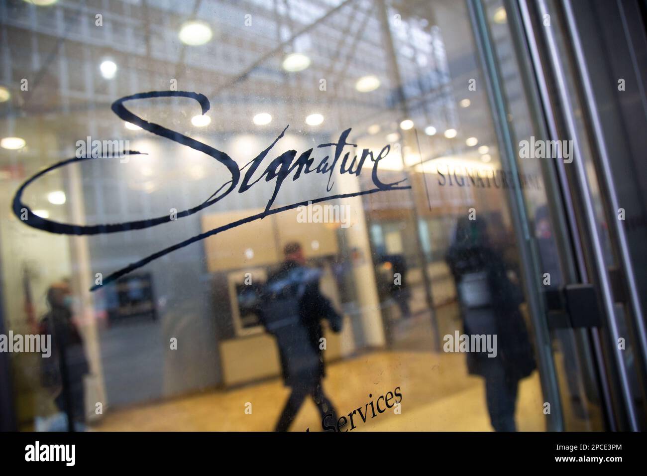 New York, USA. 13th Mar, 2023. Customers wait inside a Signature Bank ...