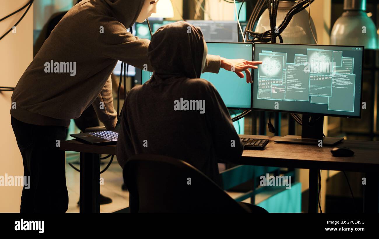 Dangerous thief gaining database access into computer system, doing phishing for security breach ...