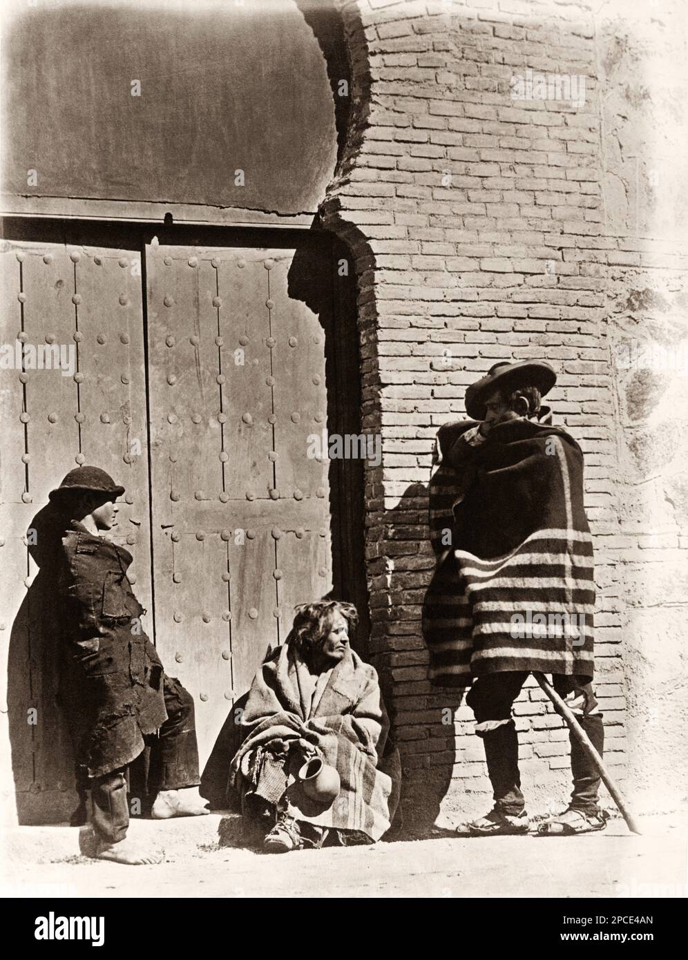 1880 ca, TOLEDO, SPAIN : Beggars at a Convent door . Photo by J ...