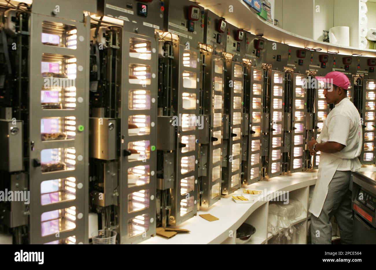 The kitchen staff restocks the vending machine at Bamn! (AP Photo ...