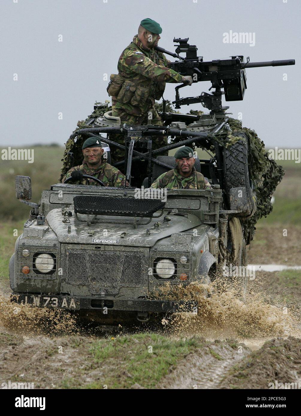 British Royal Marines display a new grenade machine gun mounted on a ...