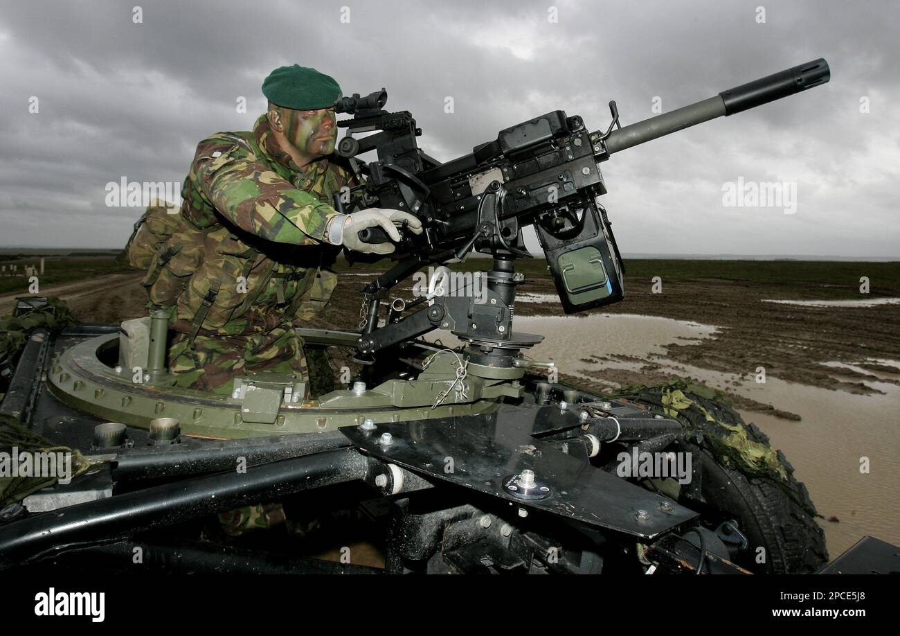 British Royal Marine Colour Sergeant Barry Fowler displays a new ...