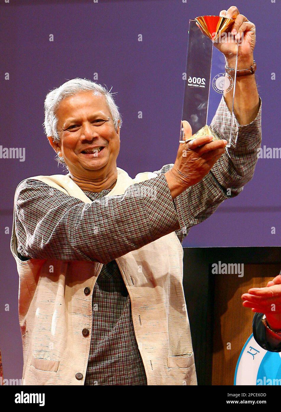 Nobel peace laureate Muhammad Yunus holds the trophy of Seoul Peace ...