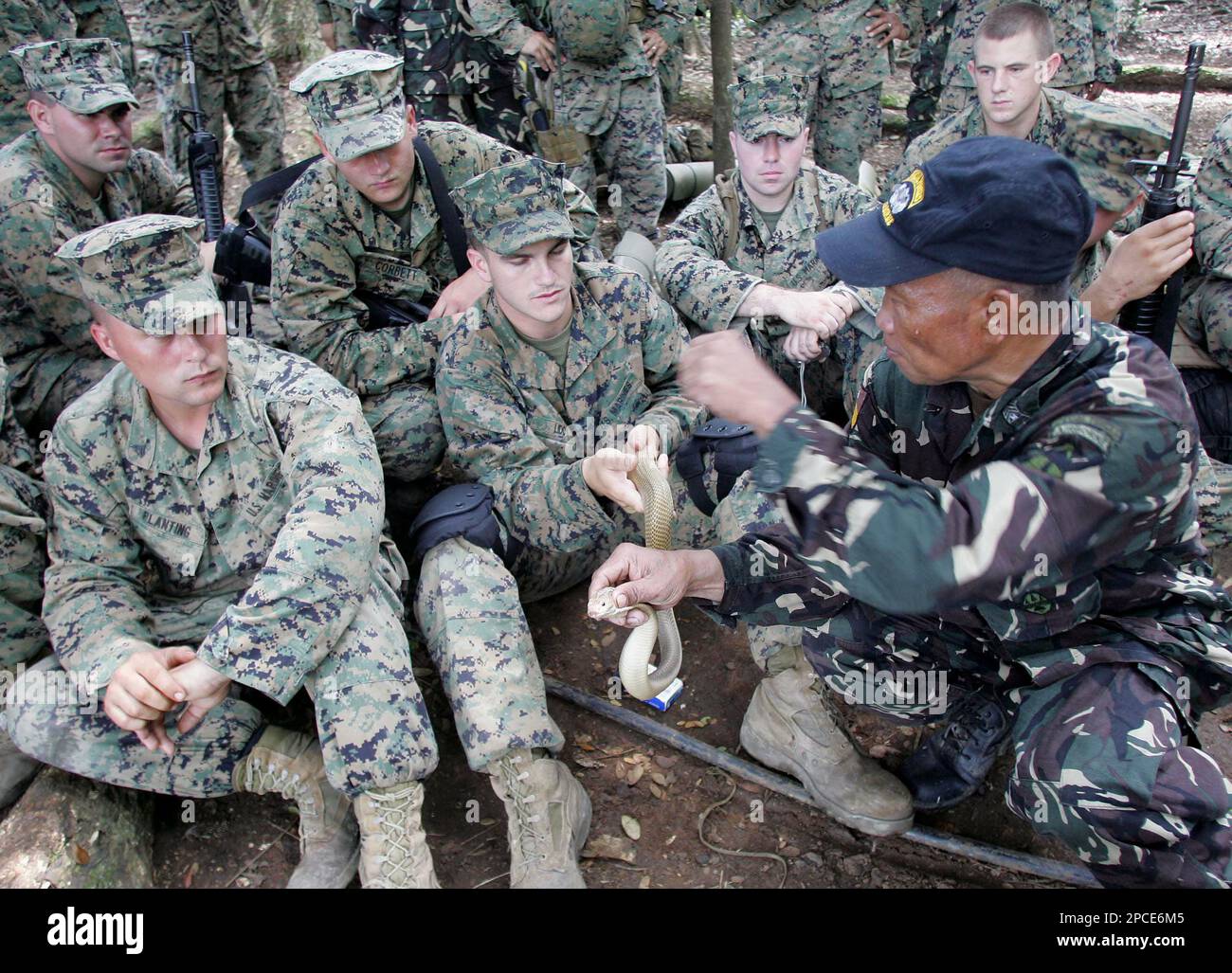 Philippine Army Special Forces Master Sergeant Jaime Agonoy, right ...
