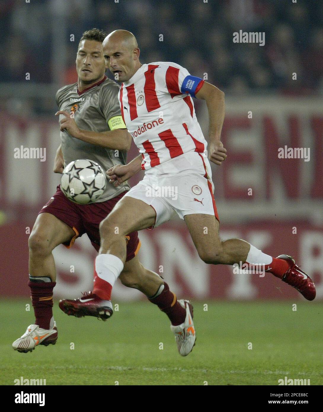 Olympiakos' Predrag Djordjevic from Serbia, right, fights for the ball ...