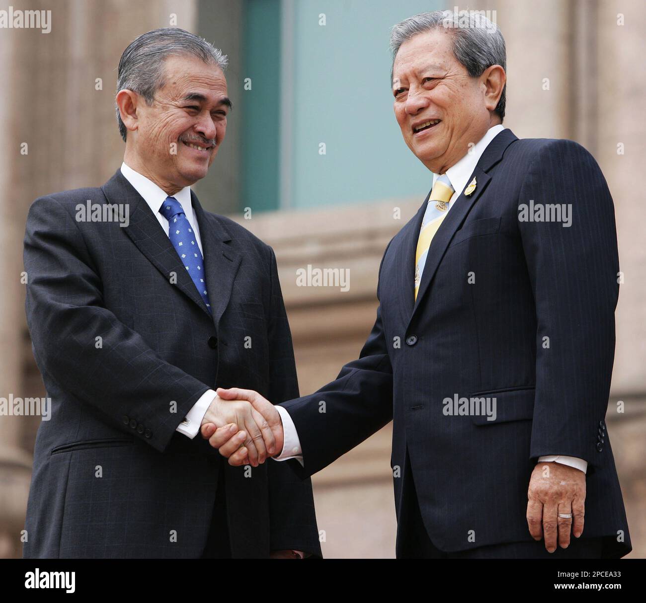 Thailand's Prime Minister Gen. Surayud Chulanont, right, shakes hands ...