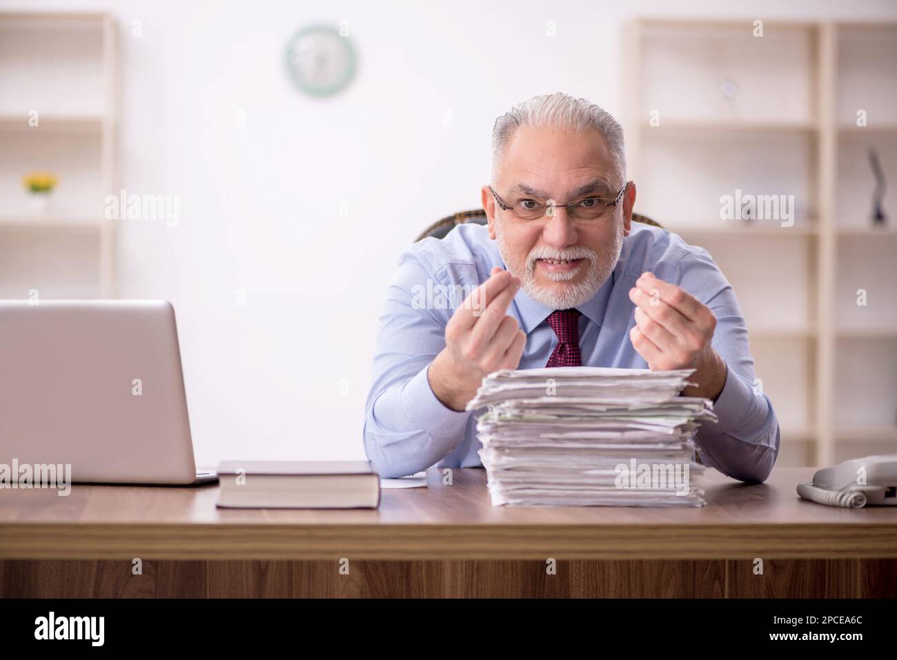 Old boss working in the office Stock Photo - Alamy