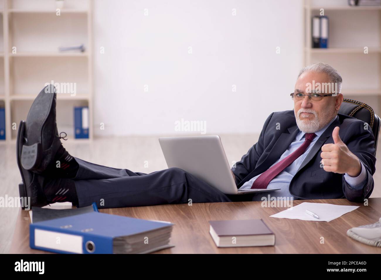 Old boss working in the office Stock Photo - Alamy