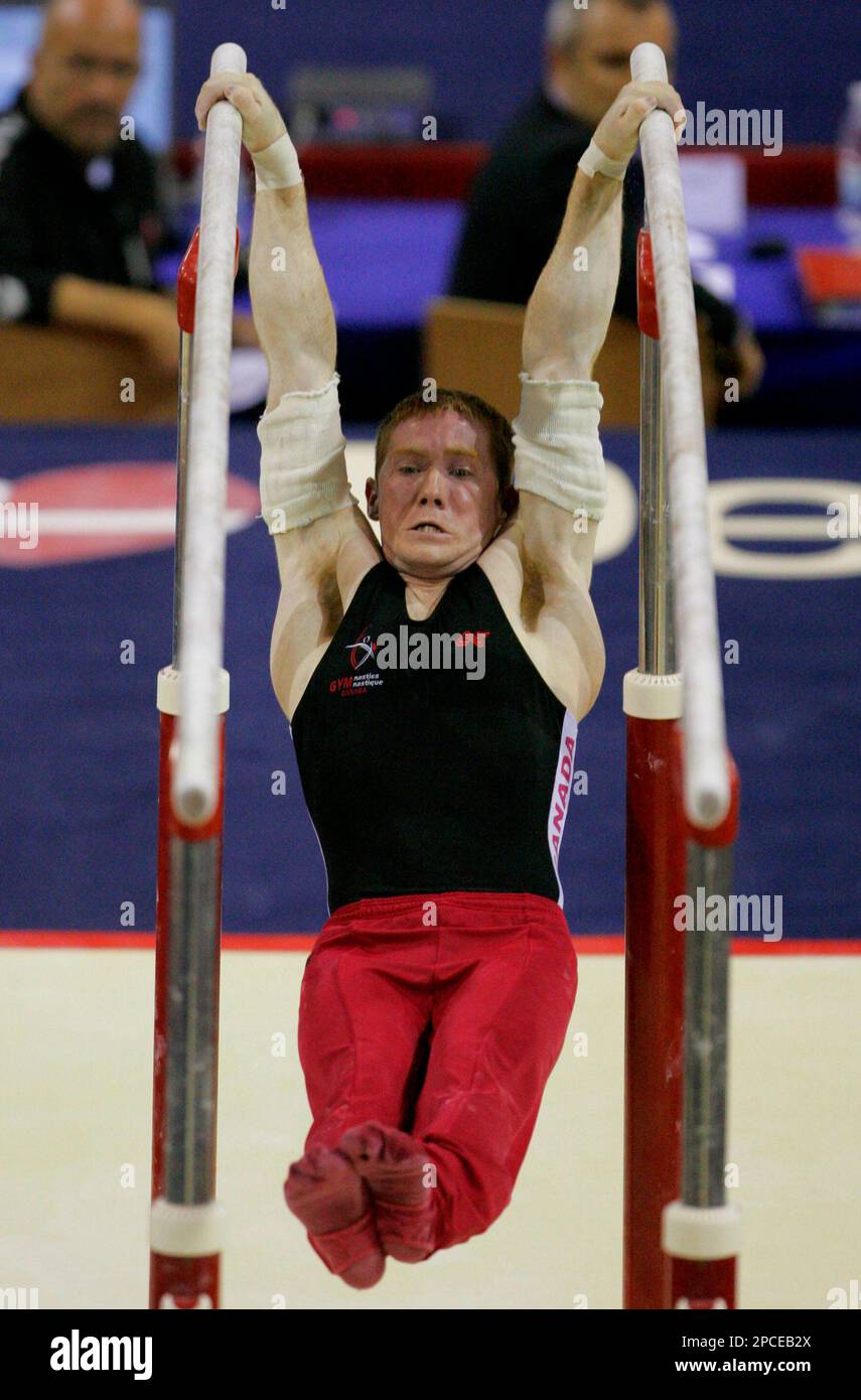 Canada's Brandon O'Neill performs on the parallel bars during the men's ...