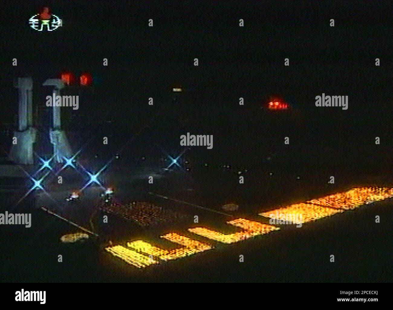North Korean's participate in a torch light parade in the North Korean ...
