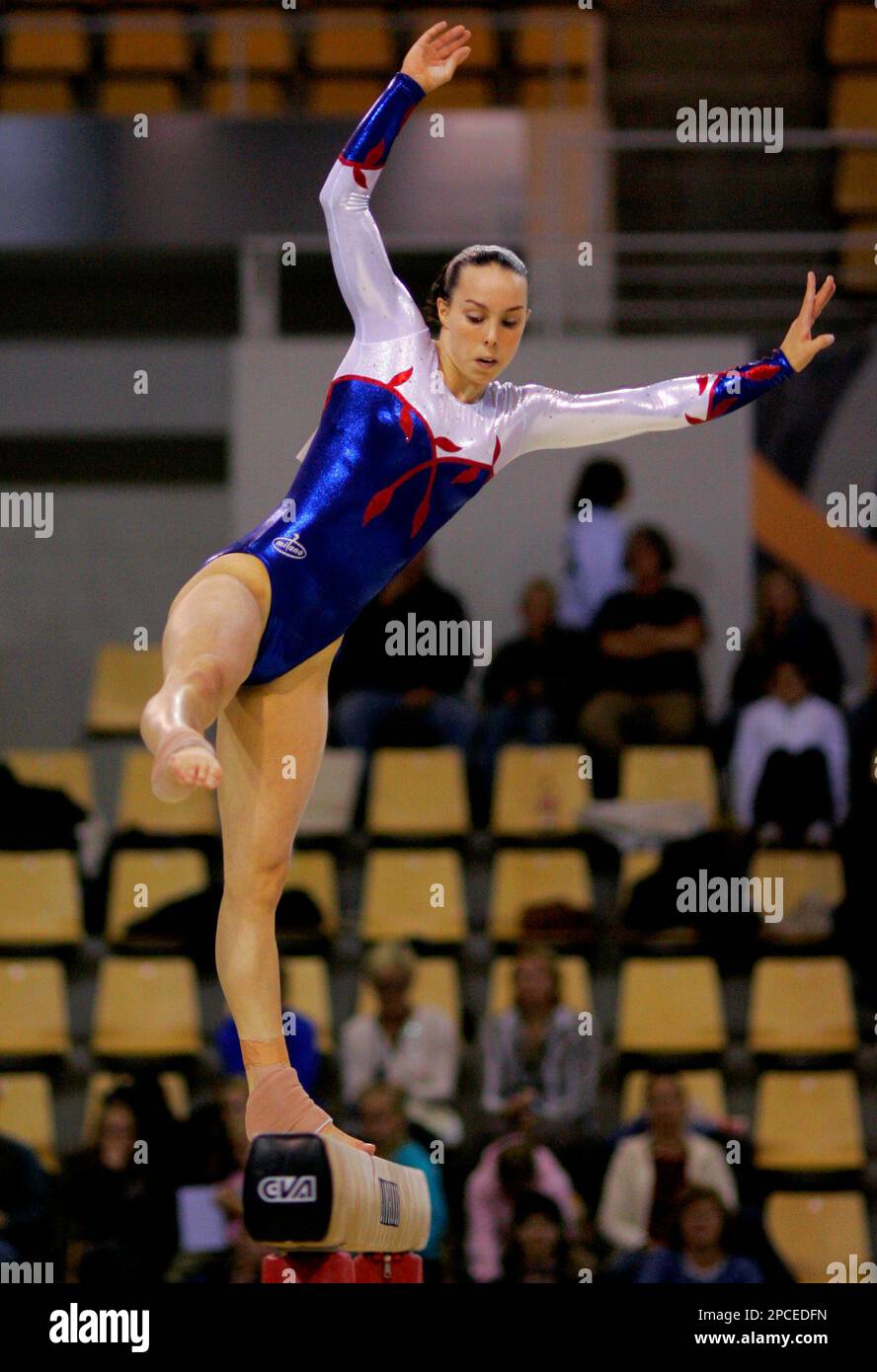 Britain's Beth Tweedle successfully attempts to keep her balance as she ...