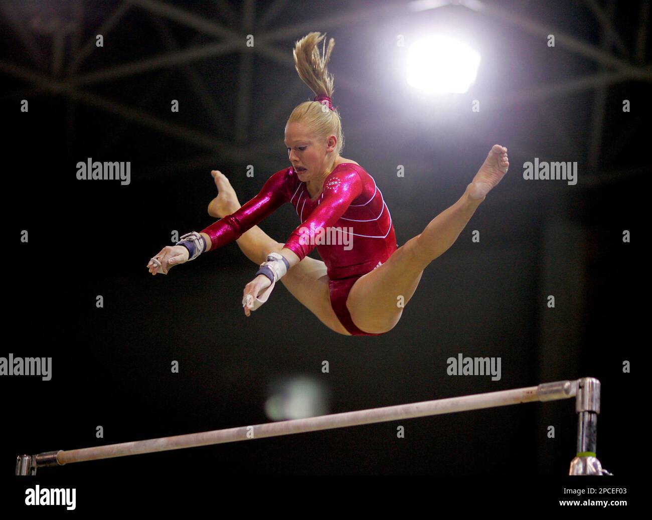 Ashley Priess of the US performs on the uneven bars in women's ...