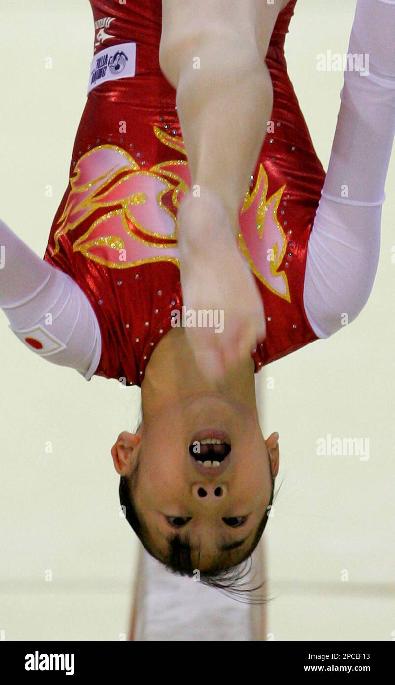 Mayu Kuroda of Japan performs her routine on the beam during women's ...