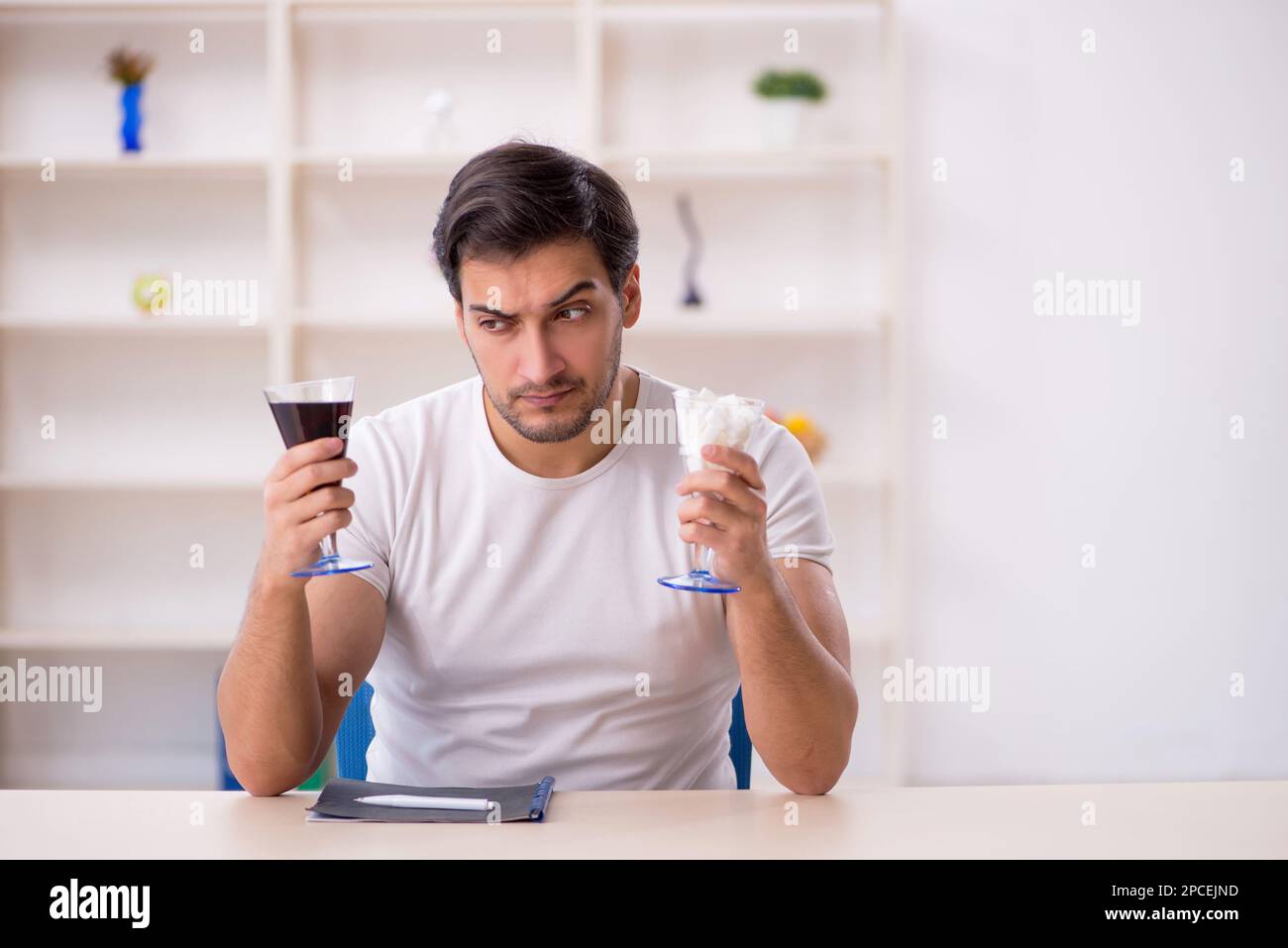Young student testing soft drink Stock Photo - Alamy