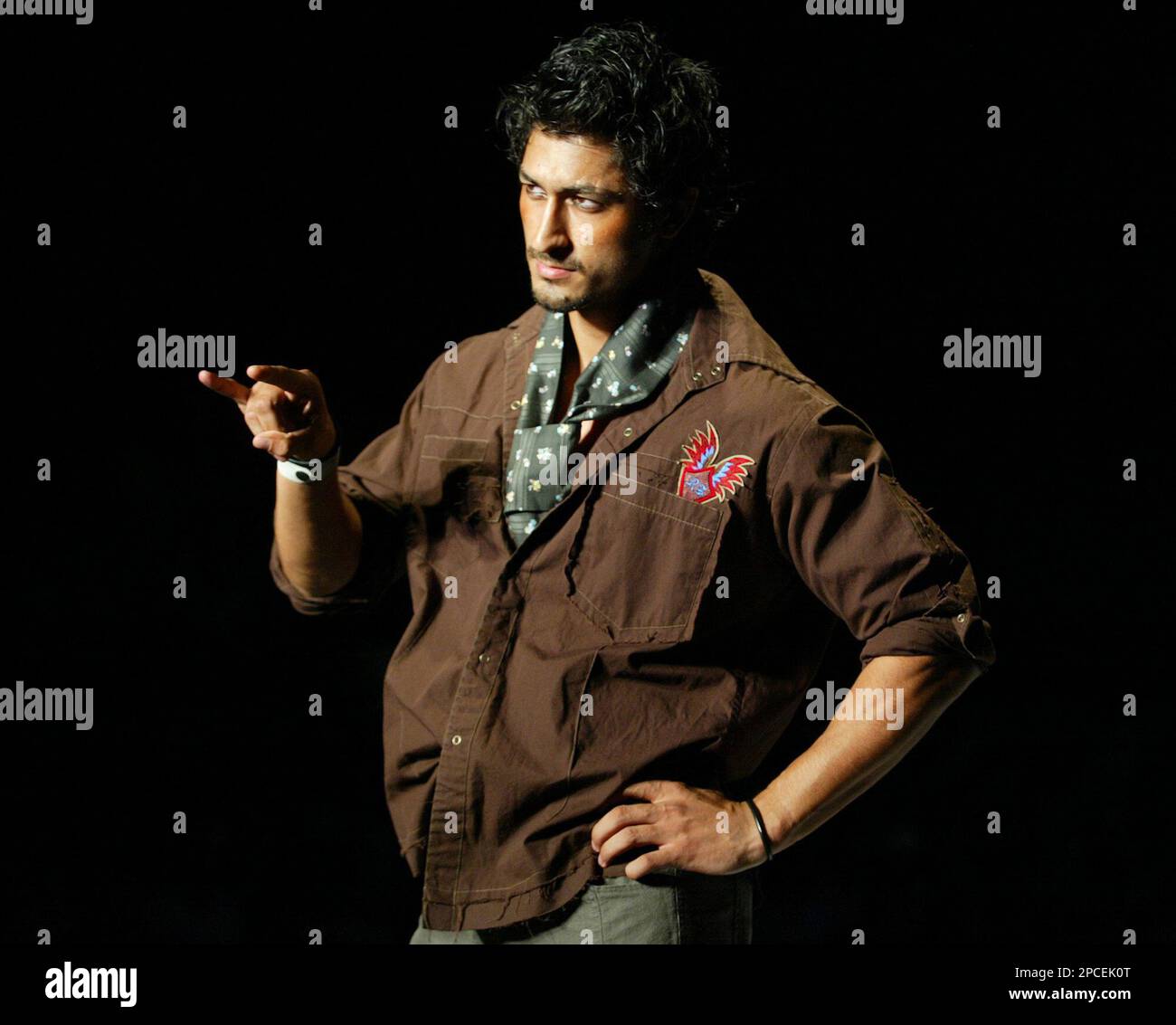 A model walks the ramp to display the creation of designer Rocky S at a ...