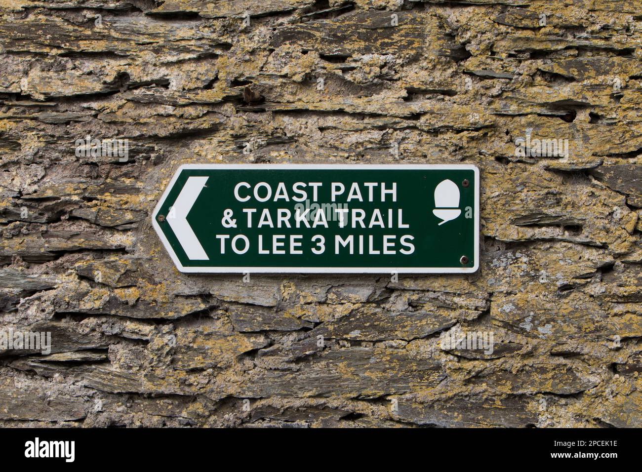 Coast Path and Tarka Trail sign post on wall. Devon. England. UK. 2023 ...