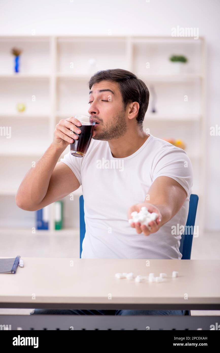 Young student testing soft drink Stock Photo - Alamy