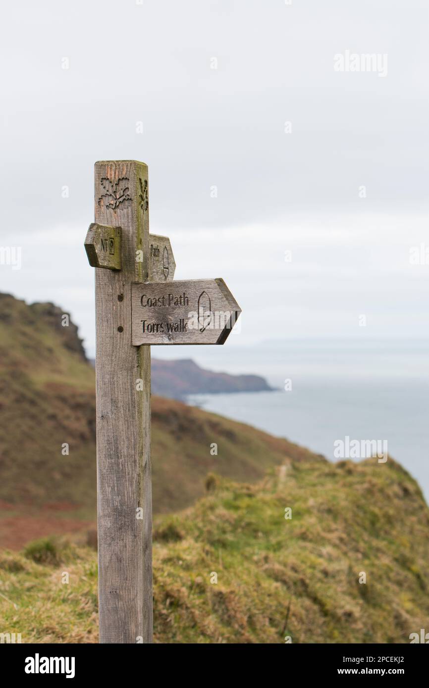 Wooden footpath sign. by coast. Devon. England. UK. 2023 Stock Photo ...