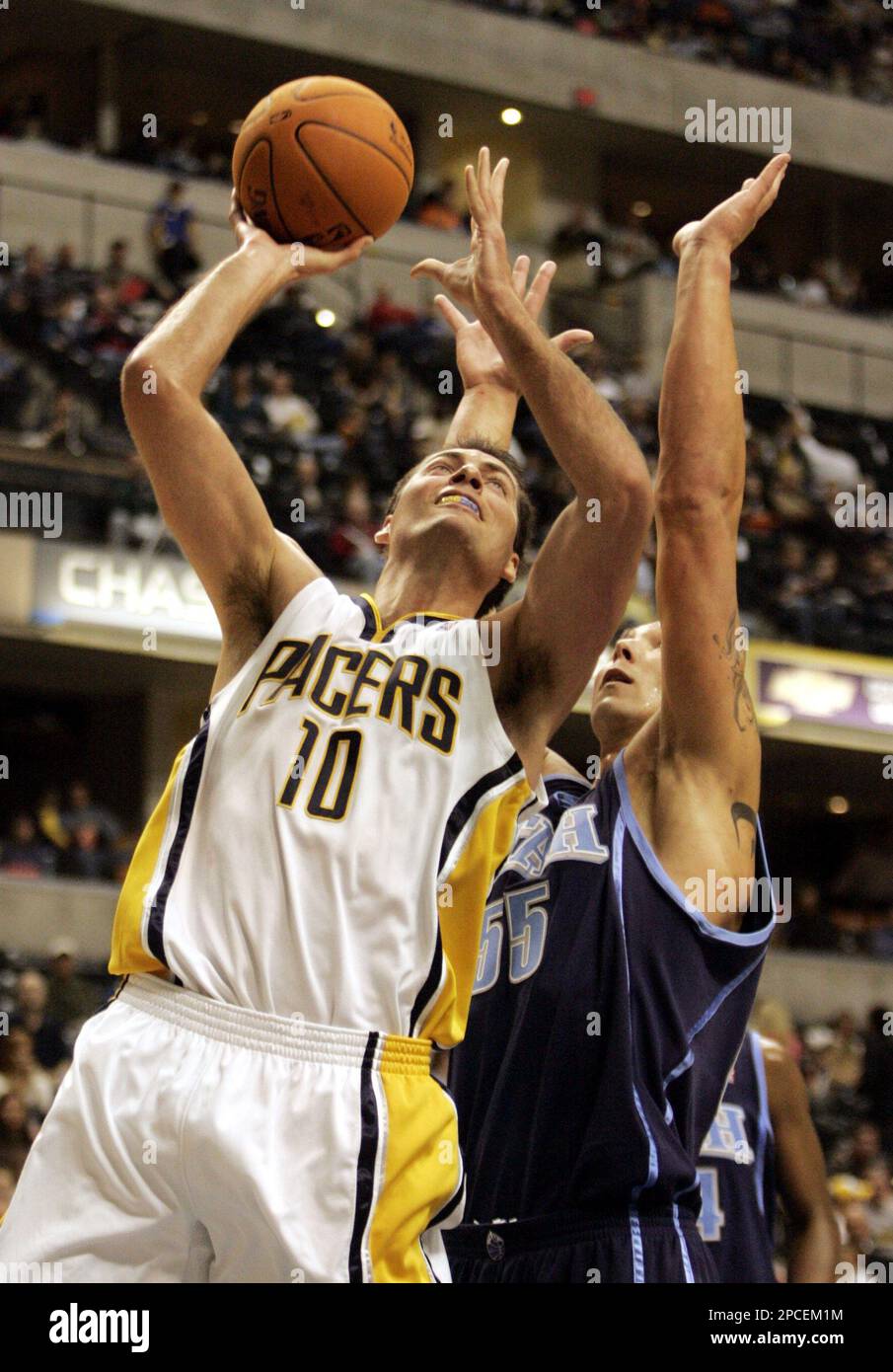 Indiana Pacers' Jeff Foster (10) puts up a shot over Utah Jazz' Rafael ...