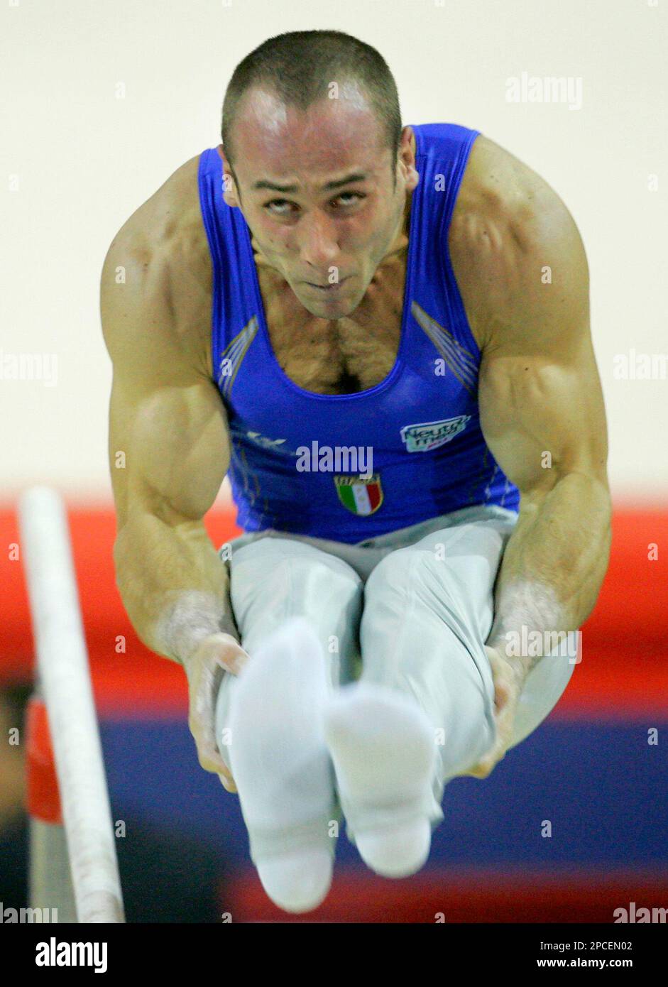 Italy's Matteo Morandi finishes his performance on the parallel bars ...