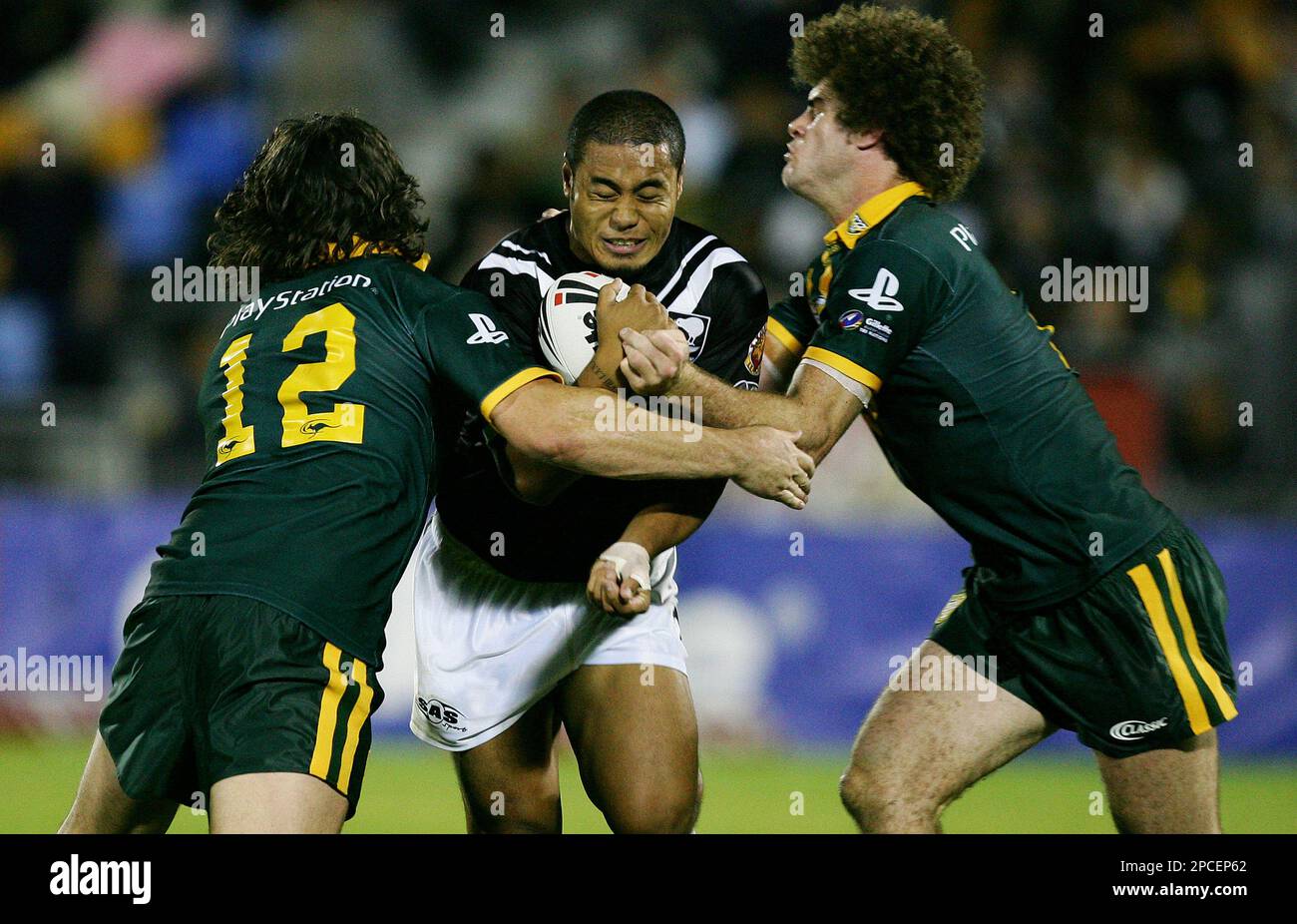 New Zealand's Steve Matai tries to burst through the tackle of ...