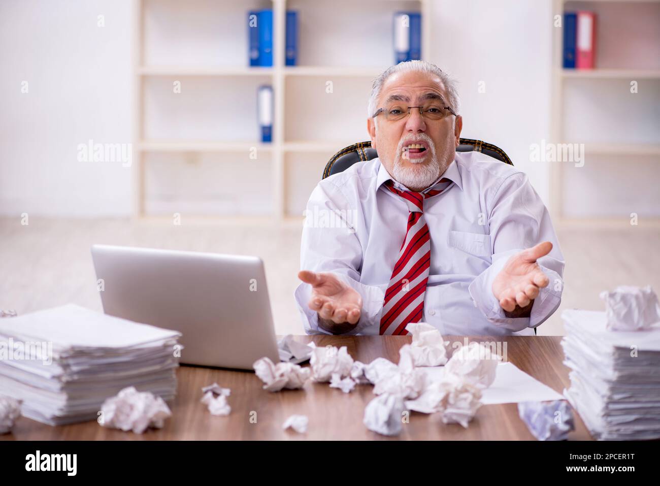 Old businessman employee in brainstorming concept Stock Photo - Alamy