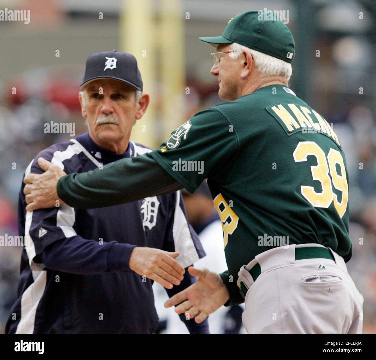 Oakland Athletics manager Ken Macha, right, shakes hands with Detroit ...