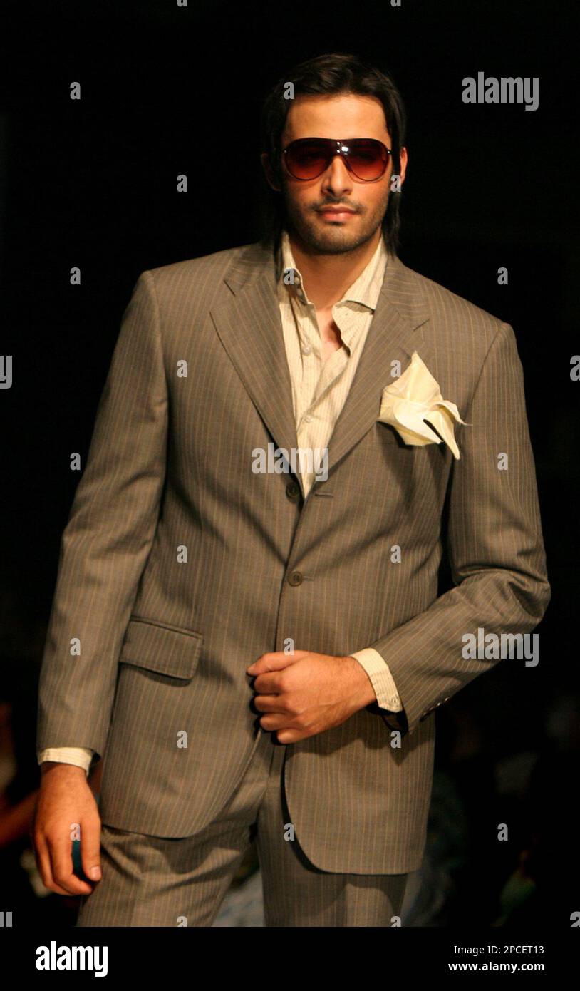 Bollywood actor and model Zulfi Sayed displays an outfit by Louis ...