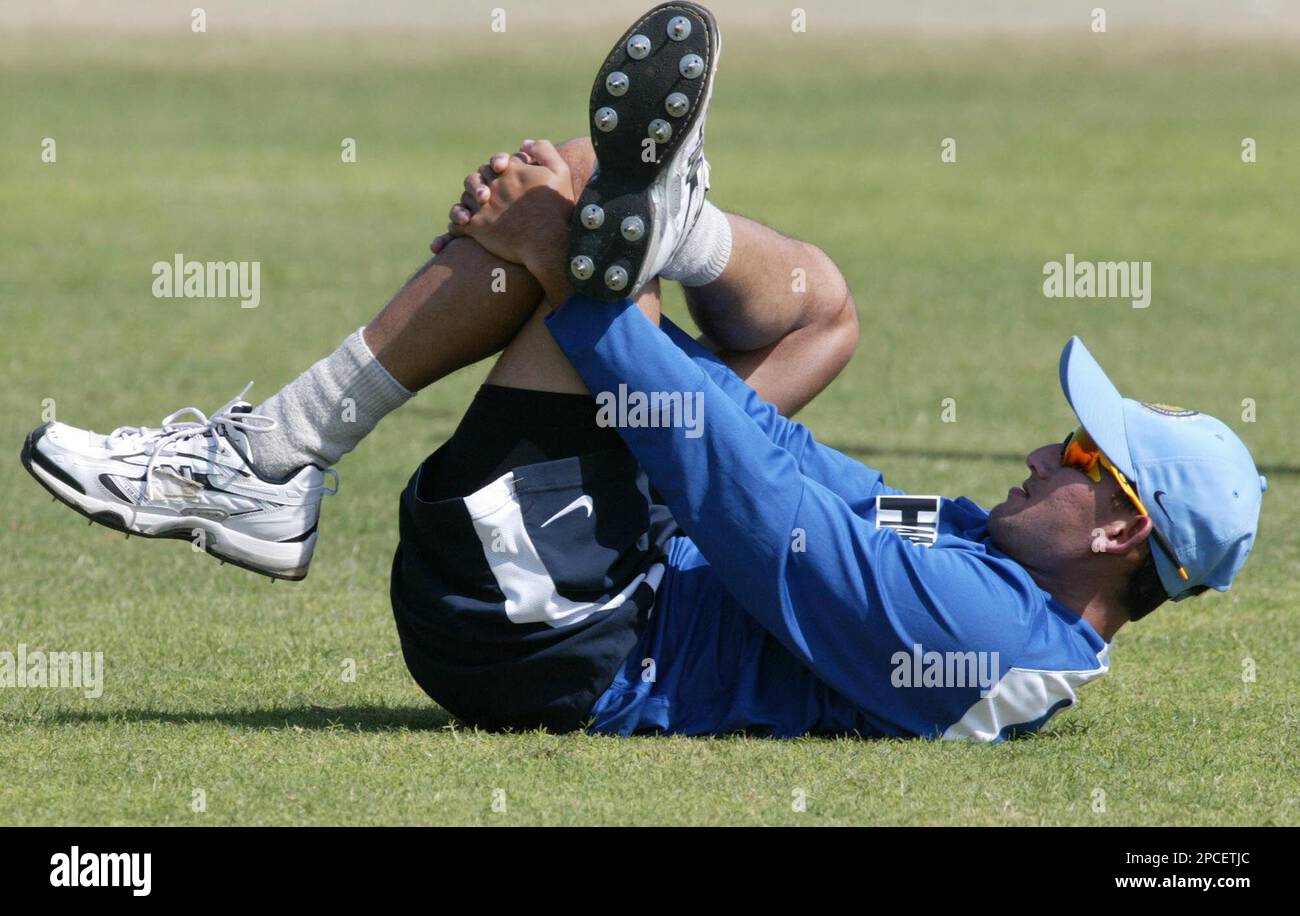 Indian cricketer Ajit Agarkar exercises during a practice session in ...