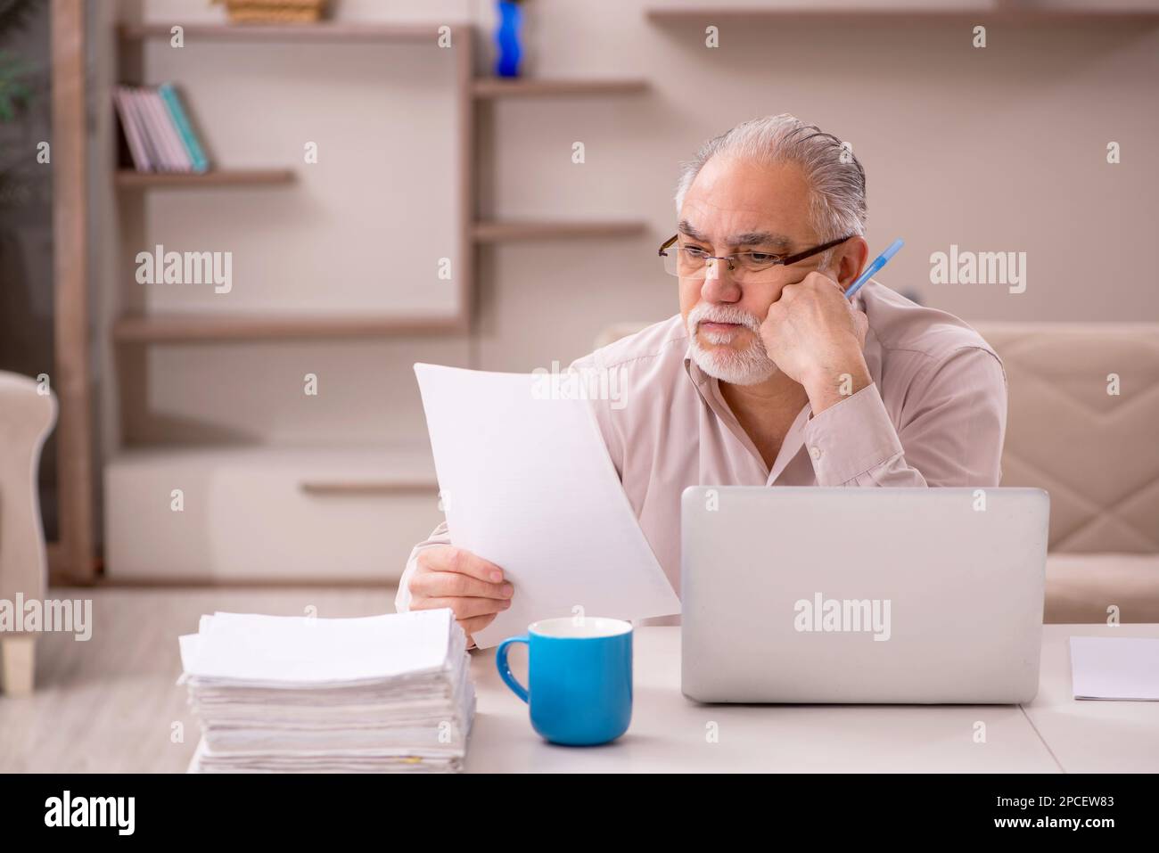 Old boss employee working from home during pandemic Stock Photo - Alamy