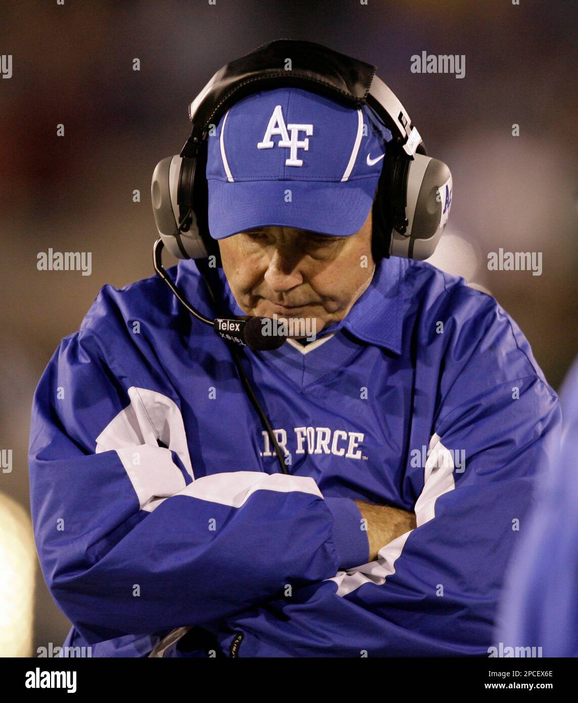 Air Force football coach Fisher DeBerry hangs his head as he paces on ...