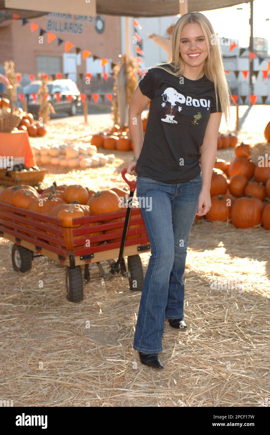 Singer-songwriter Cheyenne Kimball pulls a wagon full of pumpkins as ...