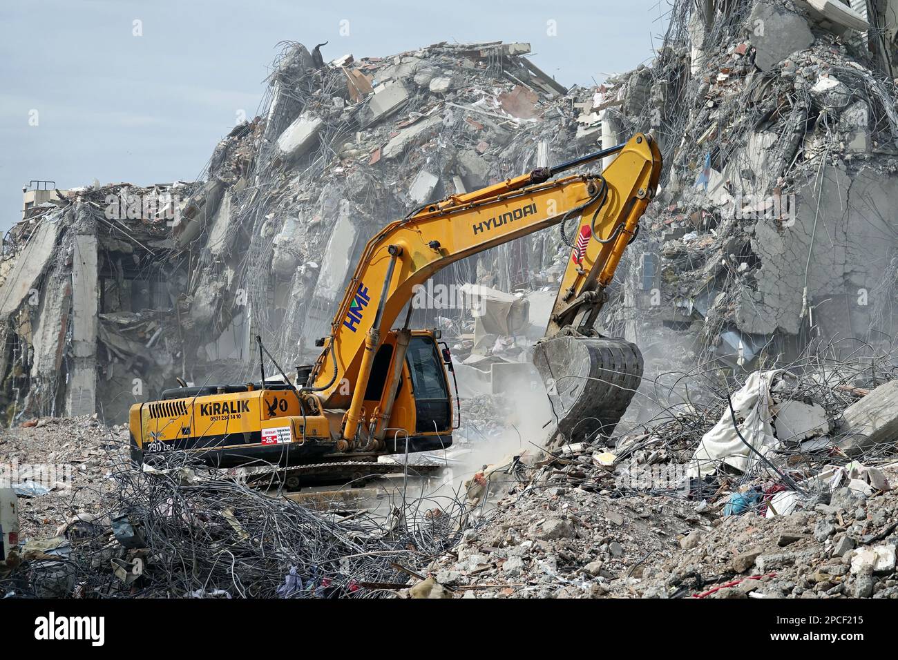 Backhoe loader sorts and clears debris from the Galeria Site, a block ...