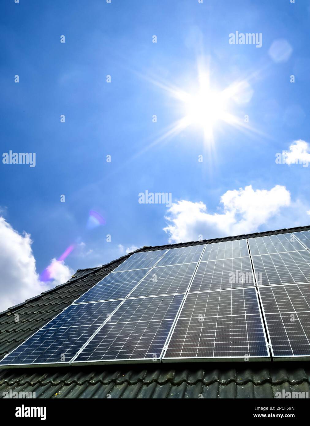 Solar panels producing clean energy on a roof of a residential house ...