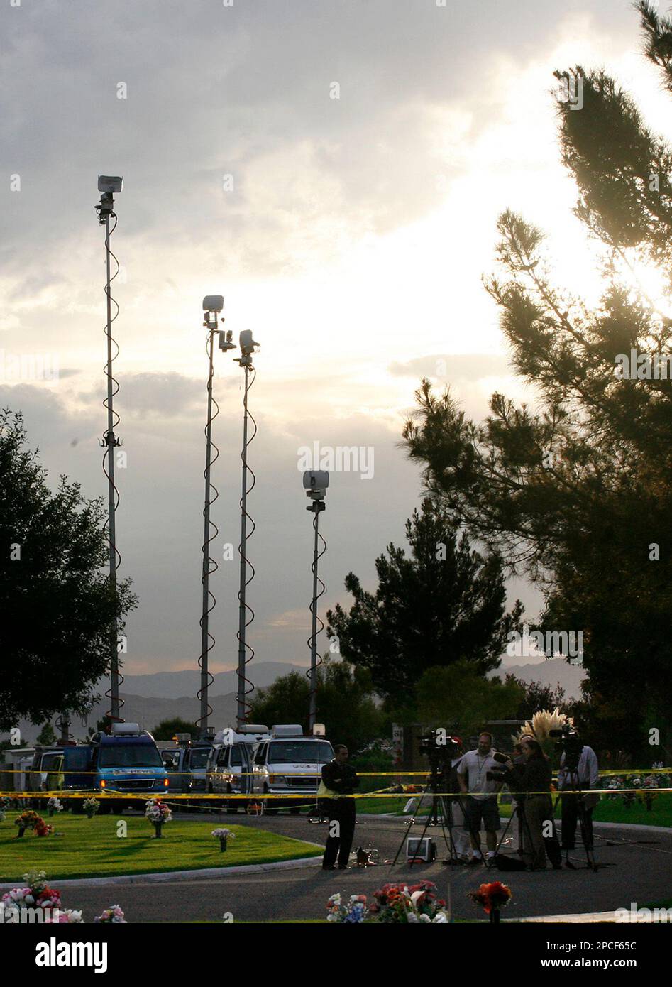 Members of the media wait for officials to exhume the casket of Charles ...
