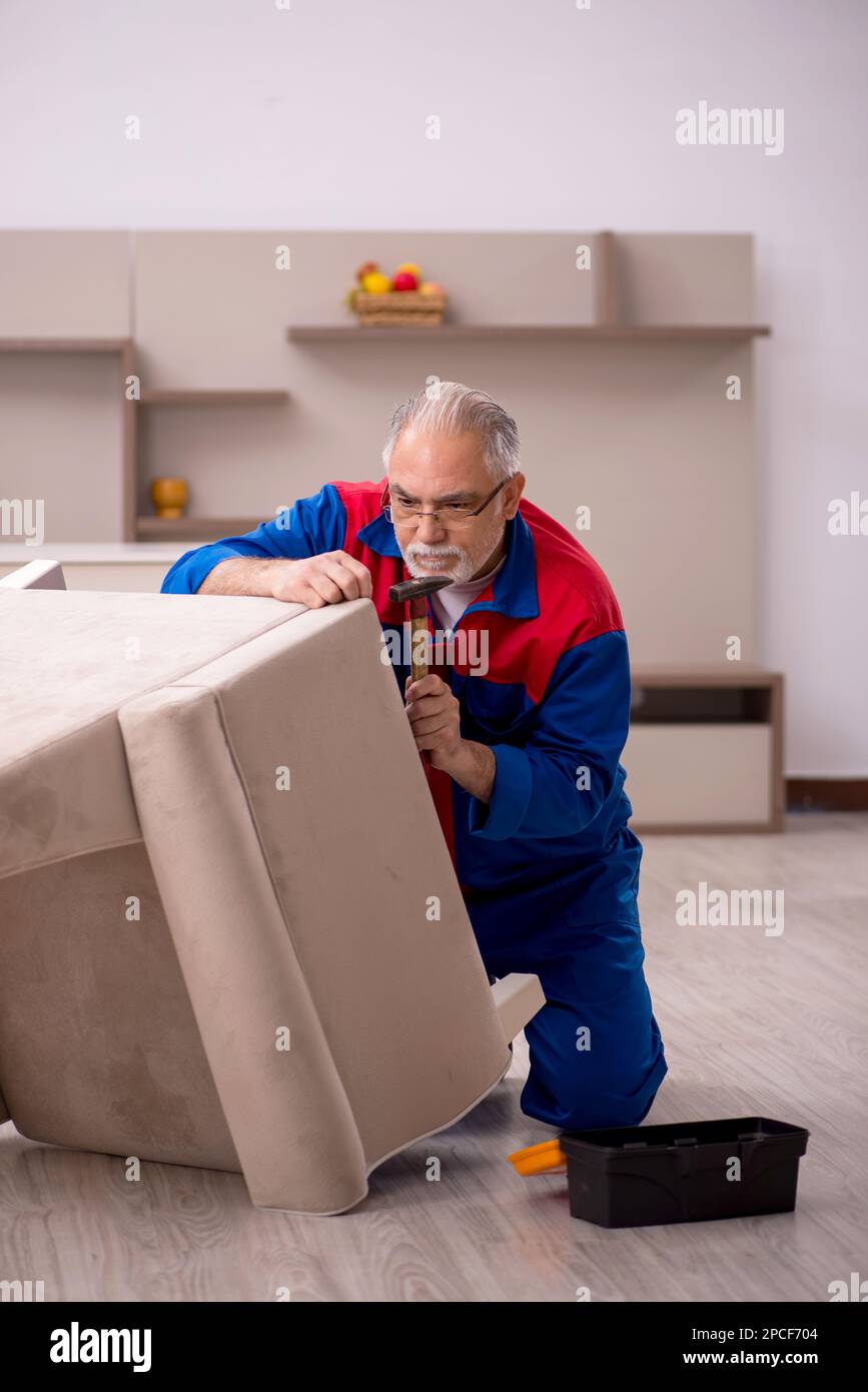 Old carpenter working at home Stock Photo - Alamy
