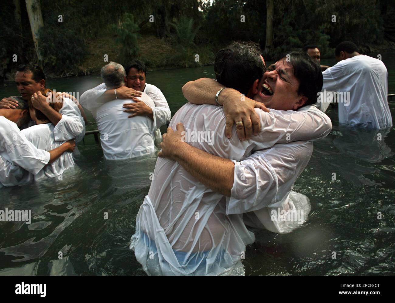 Brazilian Evangelical Christian worshippers embrace after being ...