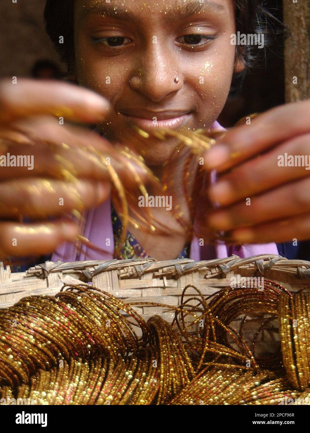 A Bangladeshi girl makes Bangles at a factory in Dhaka, Bangladesh ...
