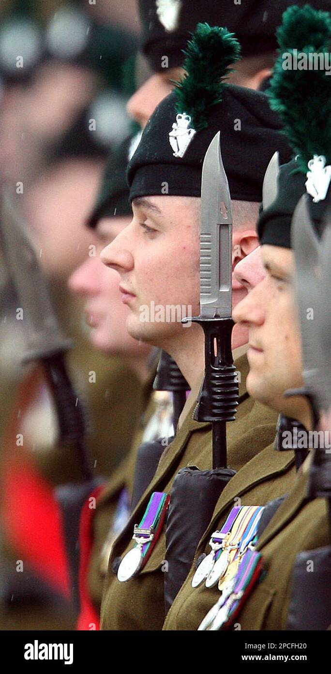 Royal Irish Regiment soldiers stand in line waiting to be inspected by ...