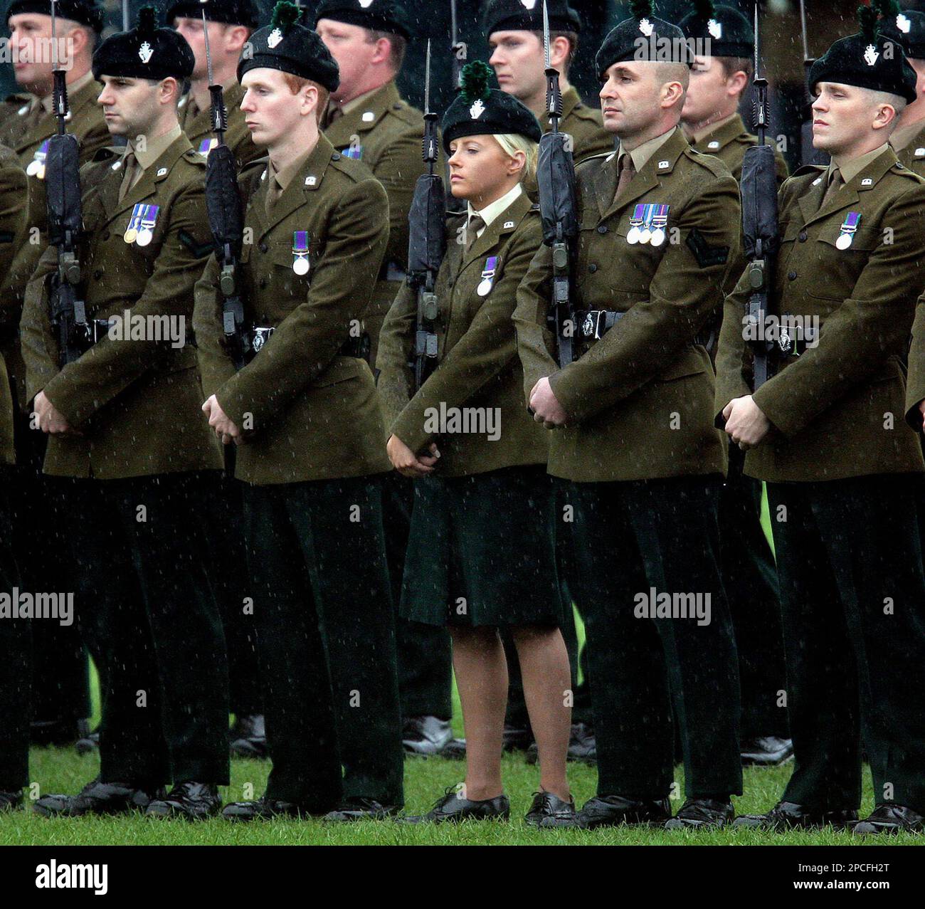 Royal Irish Regiment soldiers stand in line waiting to be inspected by ...