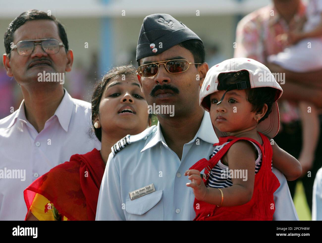 An Indian Air Force (IAF) soldier carries his daughter and watch ...