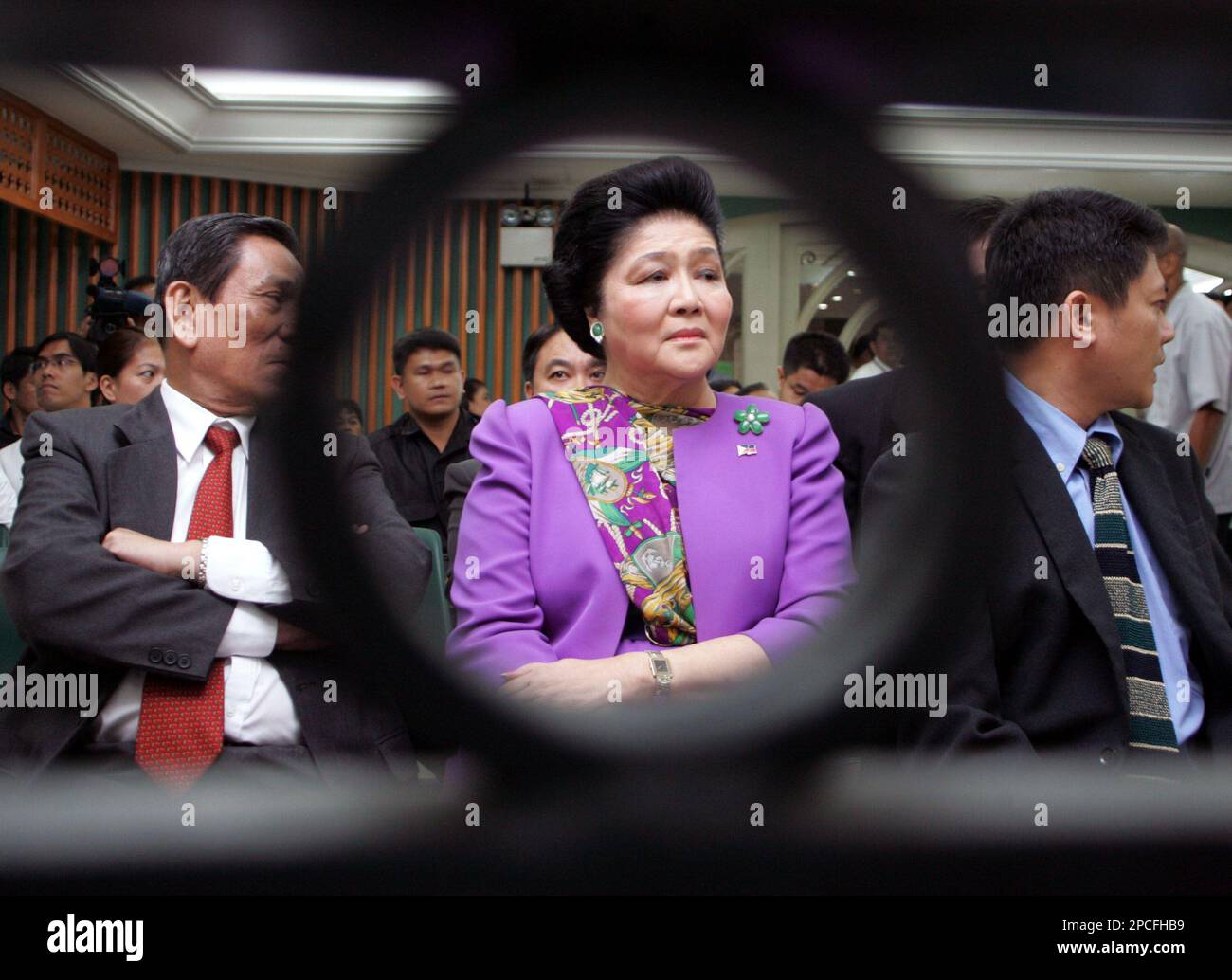 Former Philippine first lady Imelda Marcos, center, sits with her ...
