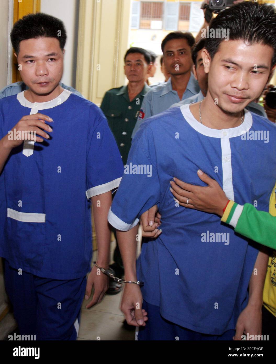 Born Samnang, right, and Sok Sam Oeun, left, walk into their appeal ...